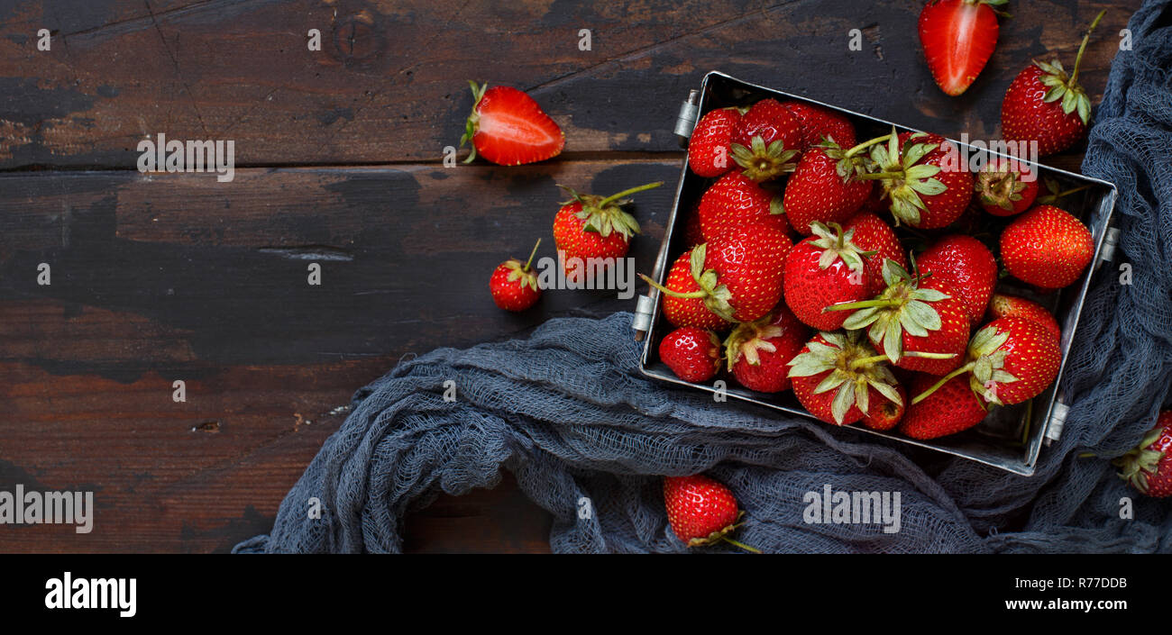 Strawberries in a box on a table Stock Photo - Alamy