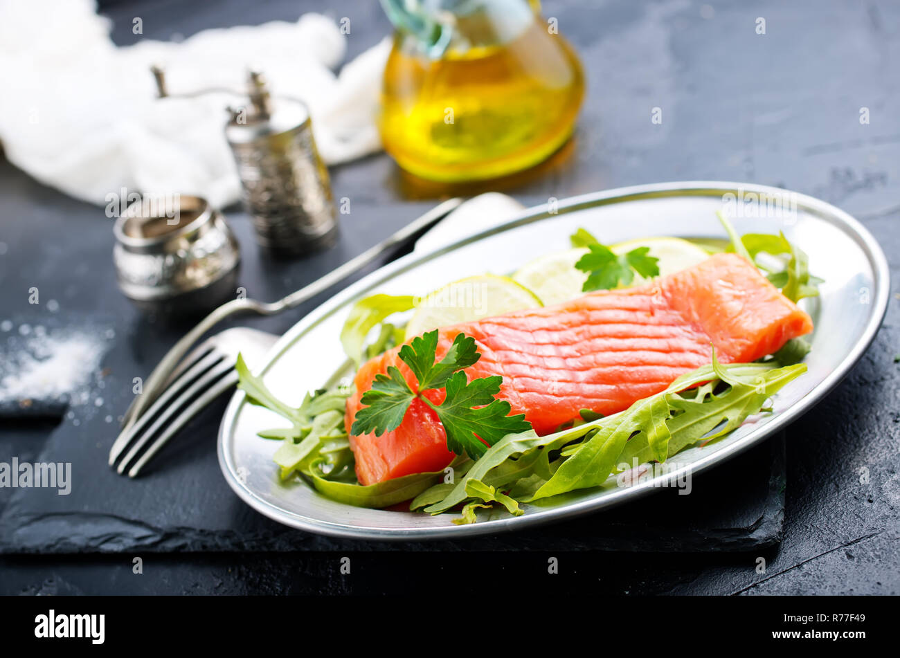 salmon fish with fresh salad on plate Stock Photo - Alamy