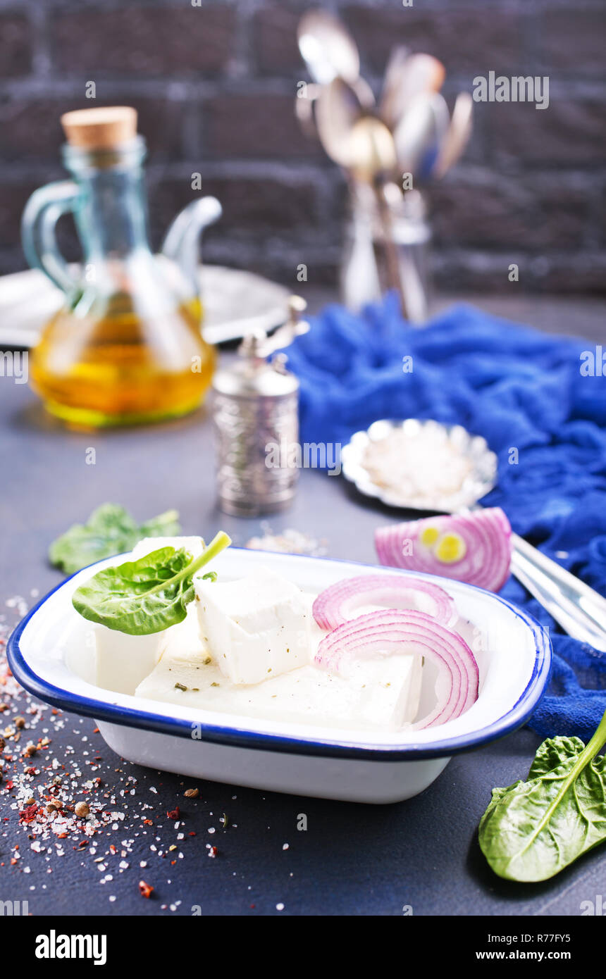 feta cheese in metal bowl on a table Stock Photo - Alamy