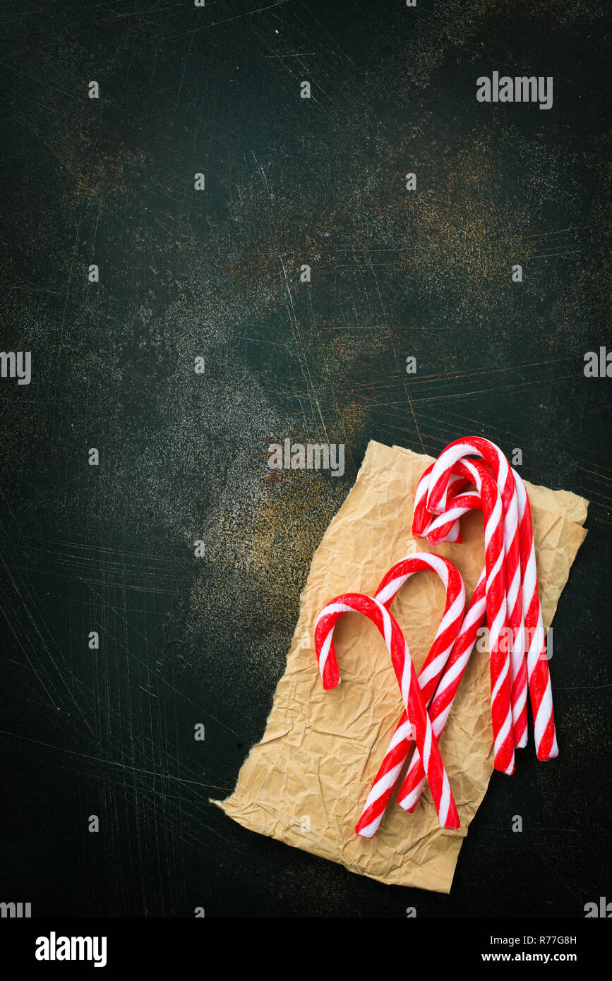 christmas candy on paper and on a table Stock Photo - Alamy