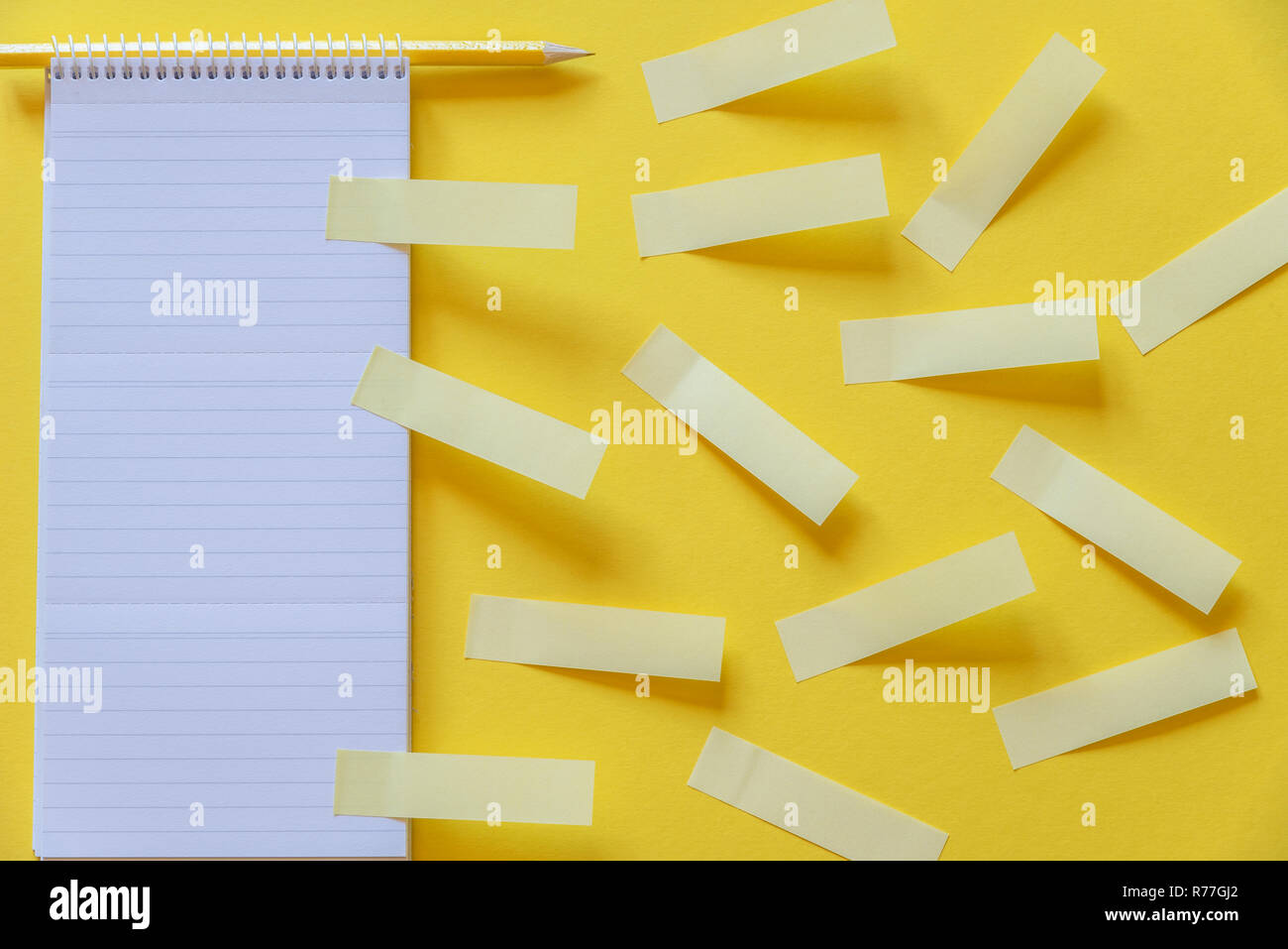 Empty notebook and yellow stickers Stock Photo - Alamy