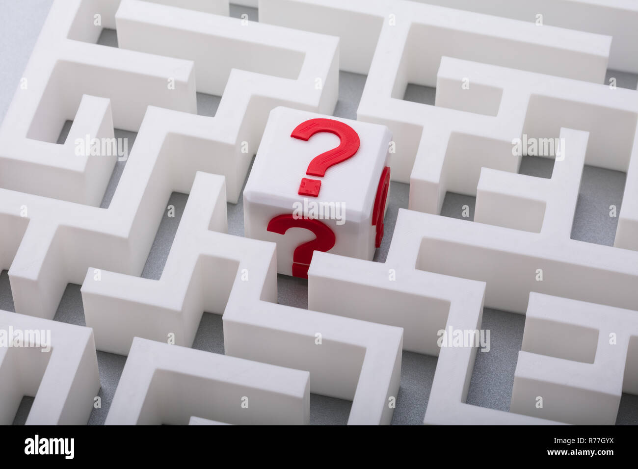 White Cube With Question Mark Sign In The Centre Of Maze Stock Photo ...