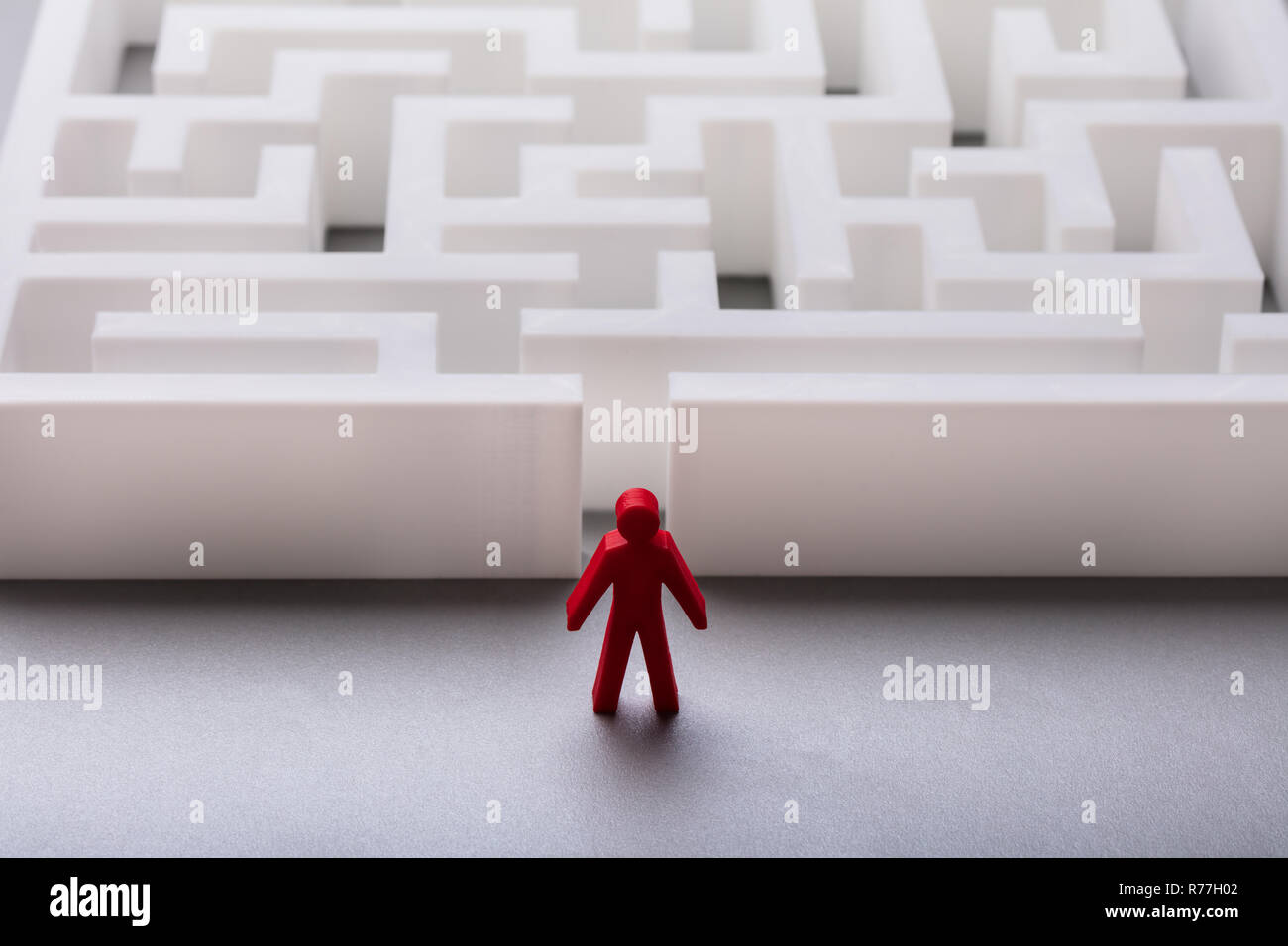 Human Figure Standing Outside Maze Entrance Stock Photo - Alamy