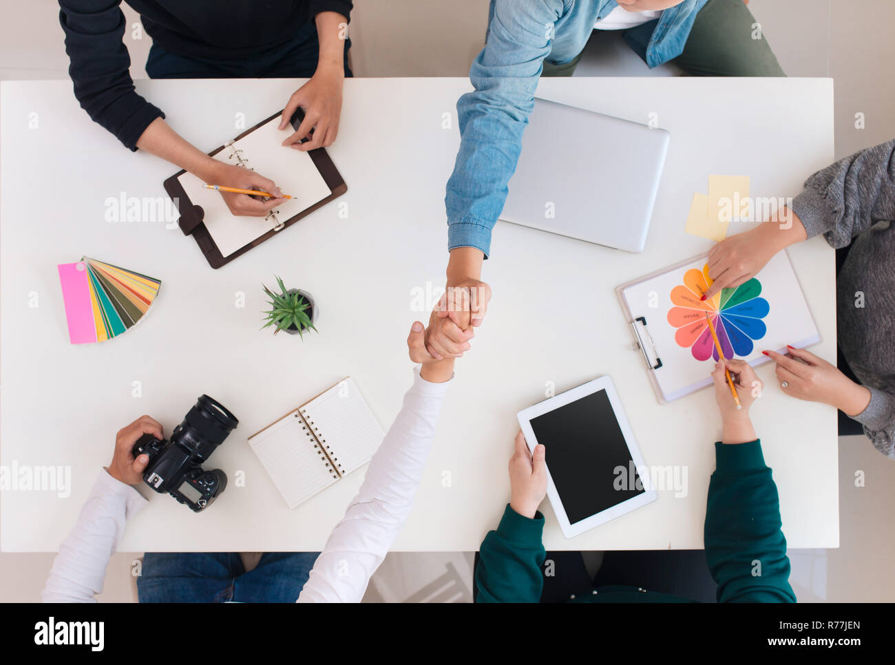 Young creative team having a meeting in creative office - teamwork ...