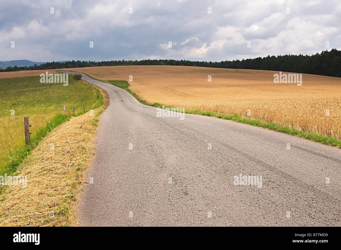 Road through farmlands Stock Photo - Alamy