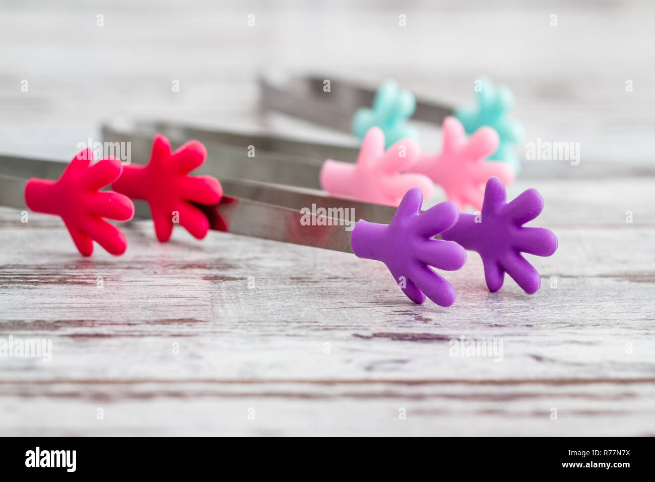 Colorful Silicon, Metal Sugar Tongs on White Background Stock Photo - Alamy