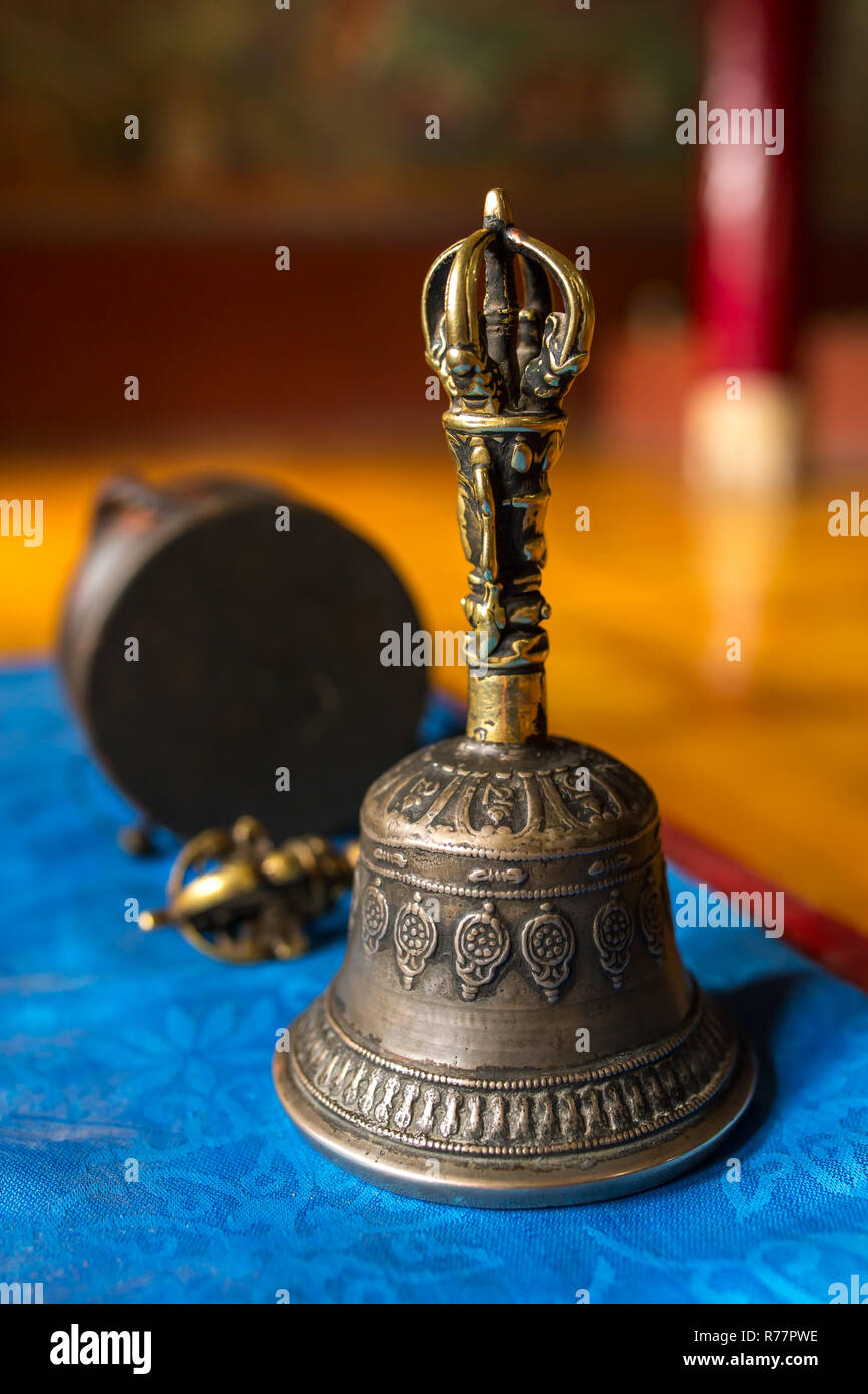 Buddhist religious equipment - Vajra Dorje and bell. Close up view in ...