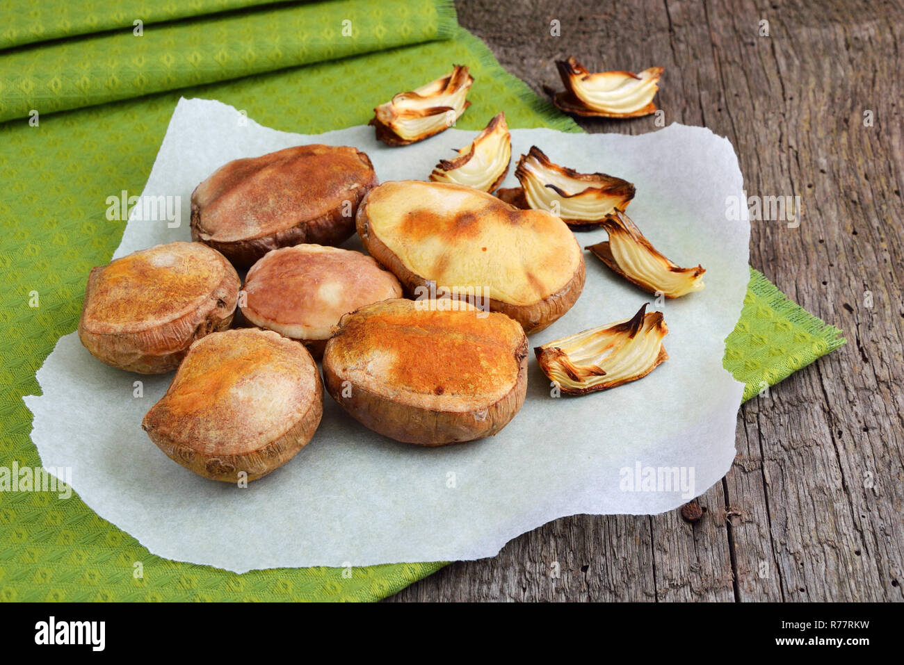 Baked halves of potatoes. Simple rural food Stock Photo - Alamy