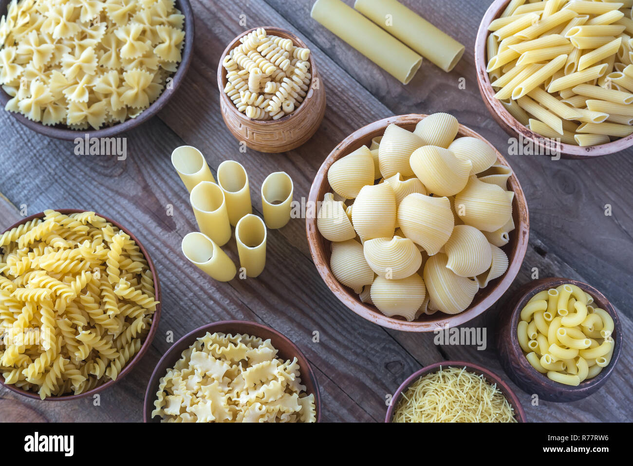 Various types of pasta on the white background Stock Photo - Alamy