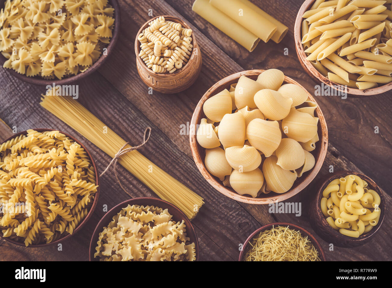 Various types of pasta on the white background Stock Photo - Alamy