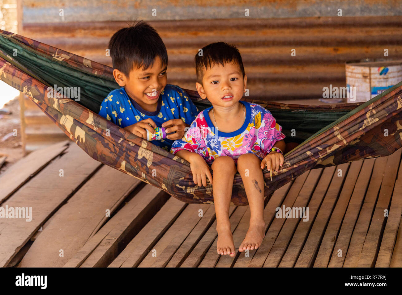 Don Daeng, Laos - April 27, 2018: Local children lying in a hammock and ...