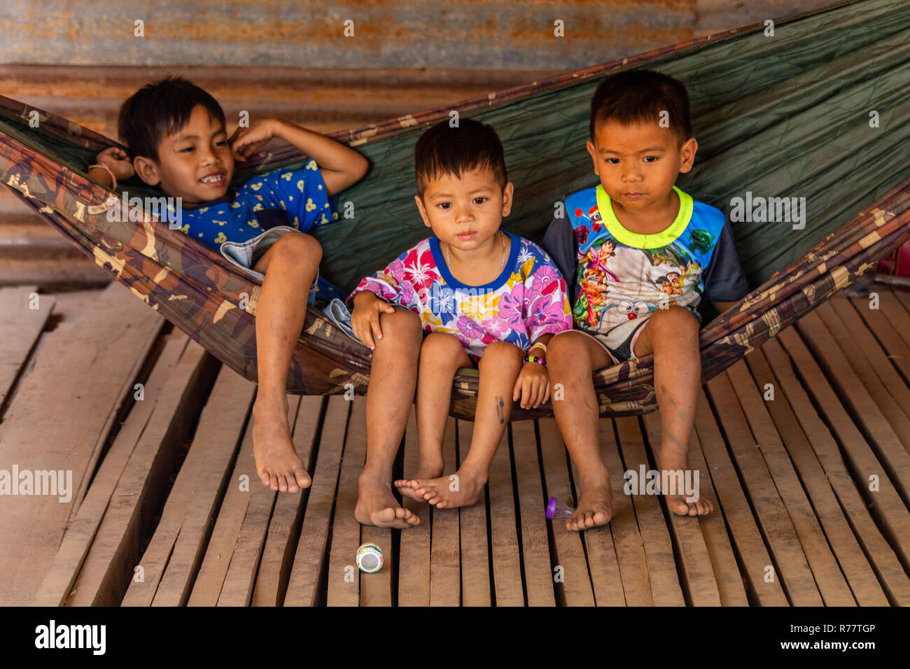 Don Daeng, Laos - April 27, 2018: Local children lying in a hammock and ...