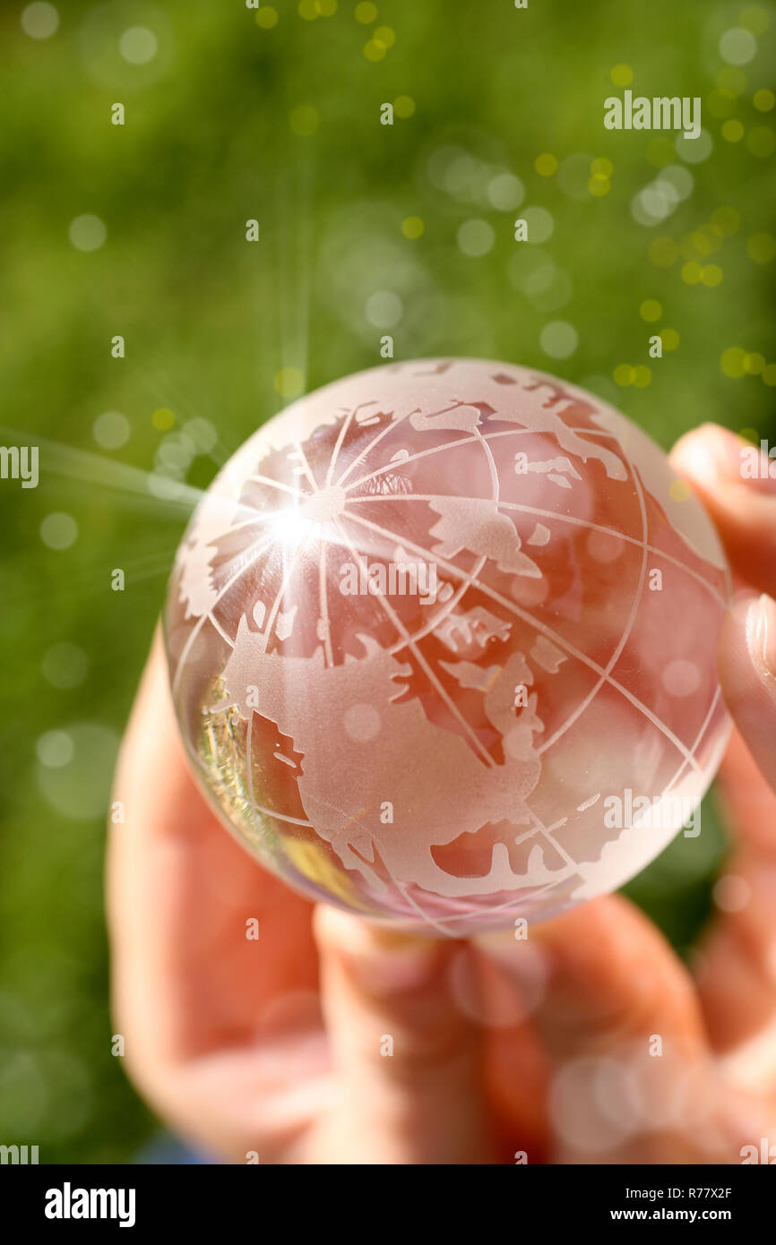 hand holding glass globe Stock Photo - Alamy