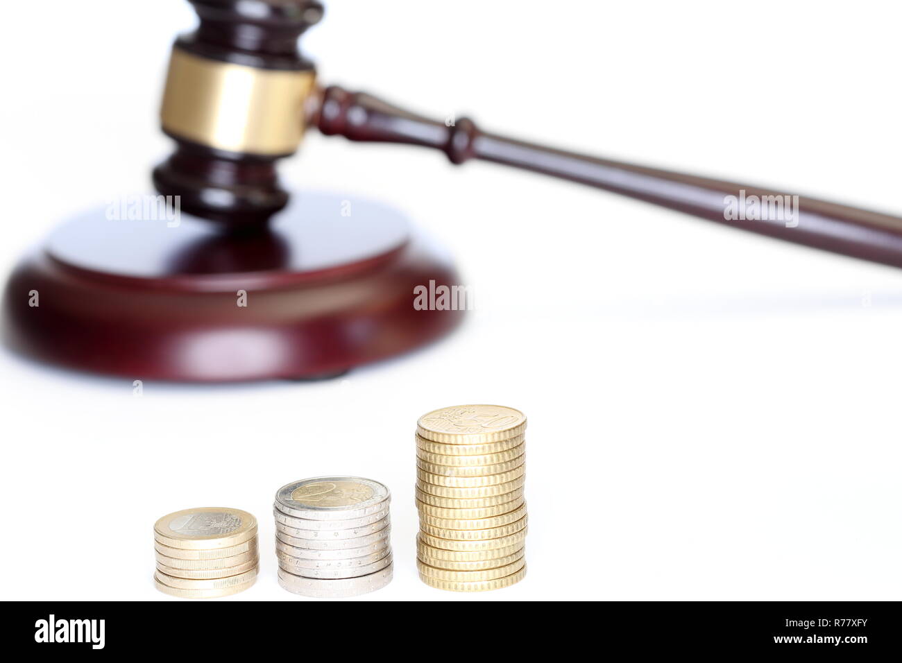 euro coins as a stack with auction symbol Stock Photo - Alamy