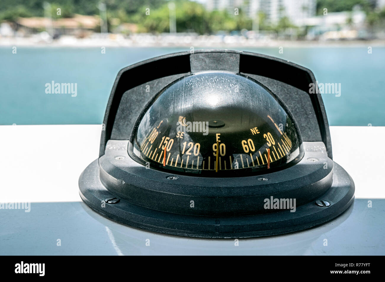 boat compass nautical instrument nobody direction route Stock Photo - Alamy