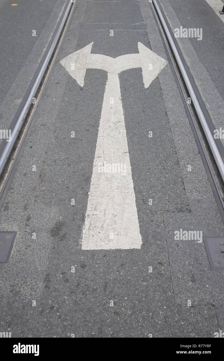 Double Direction Arrow Sign with Tram Track Stock Photo - Alamy
