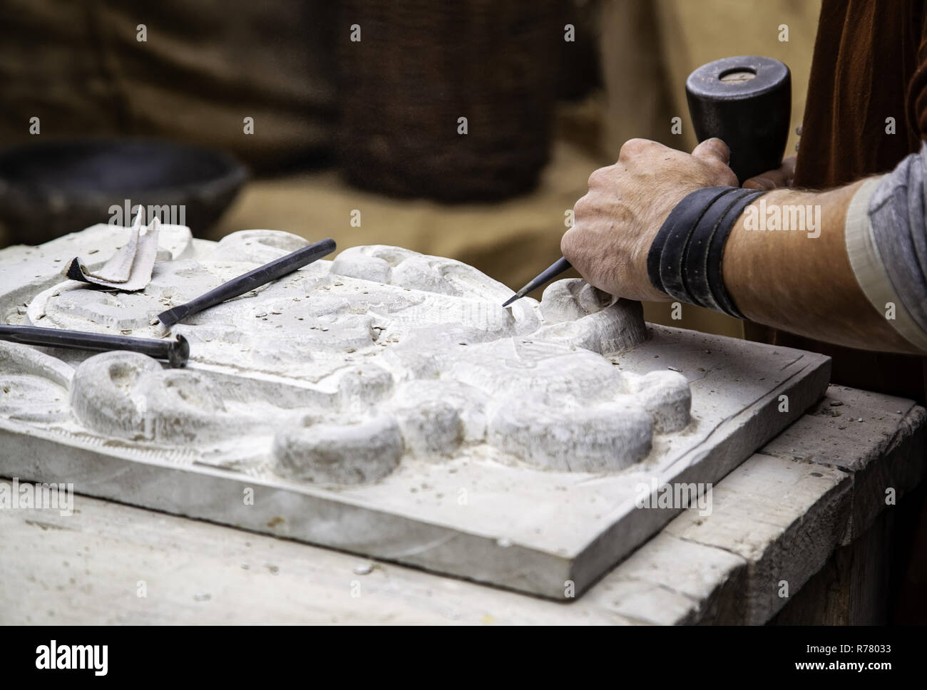 Carving stone in a traditional way, craftsmanship detail, shaping the ...