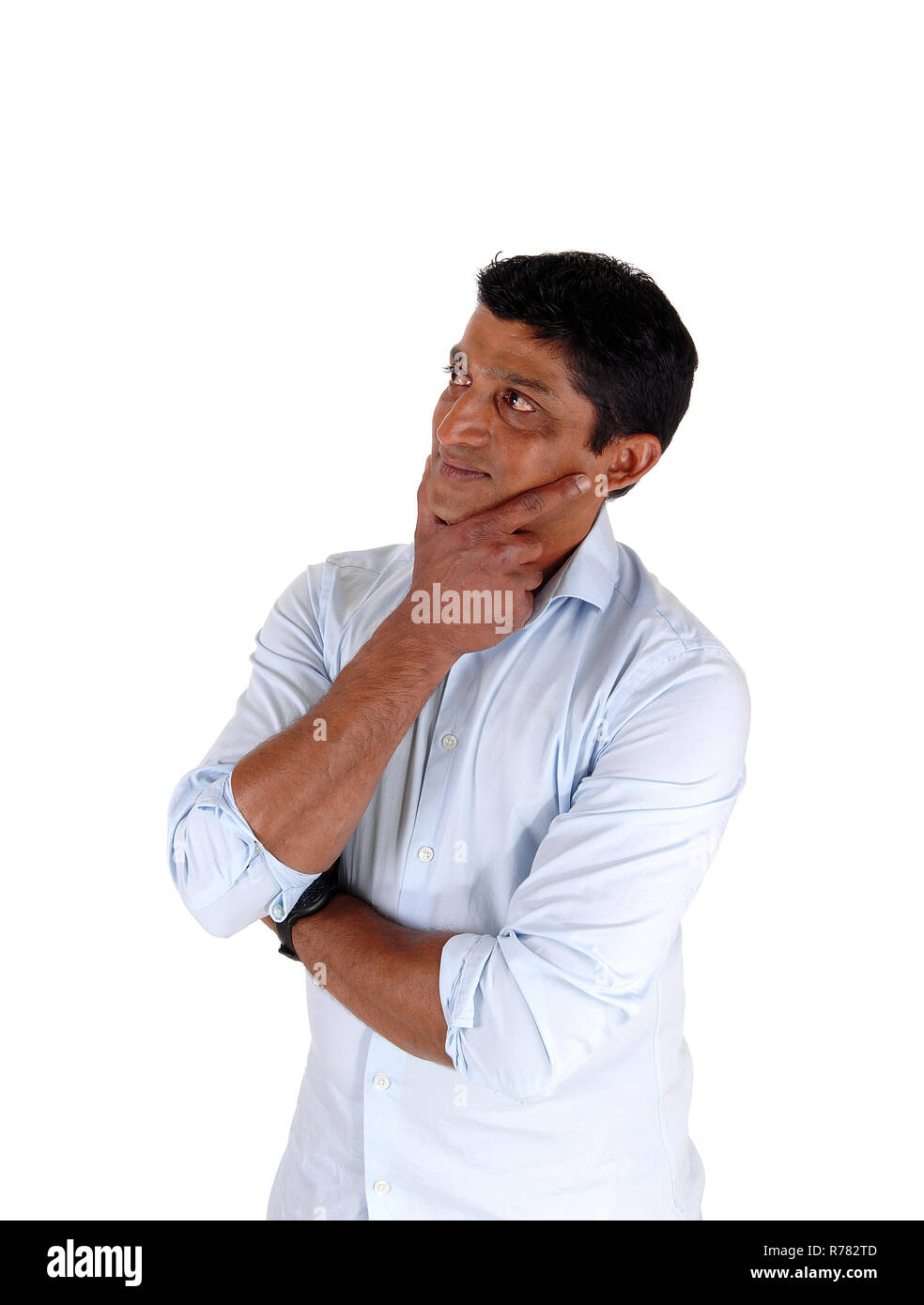 Serious looking confused man standing Stock Photo - Alamy