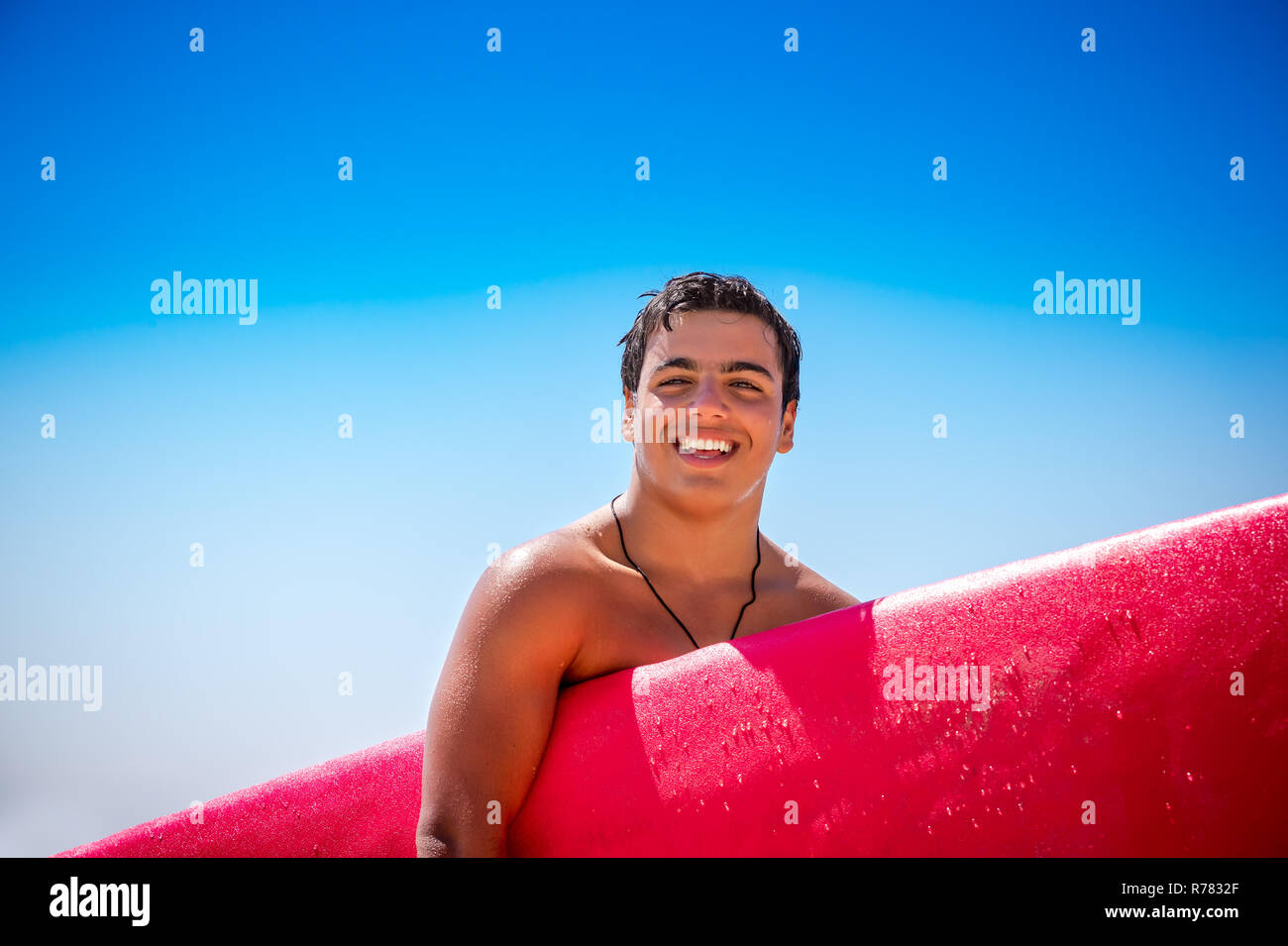 Cheerful surfboarder portrait Stock Photo - Alamy