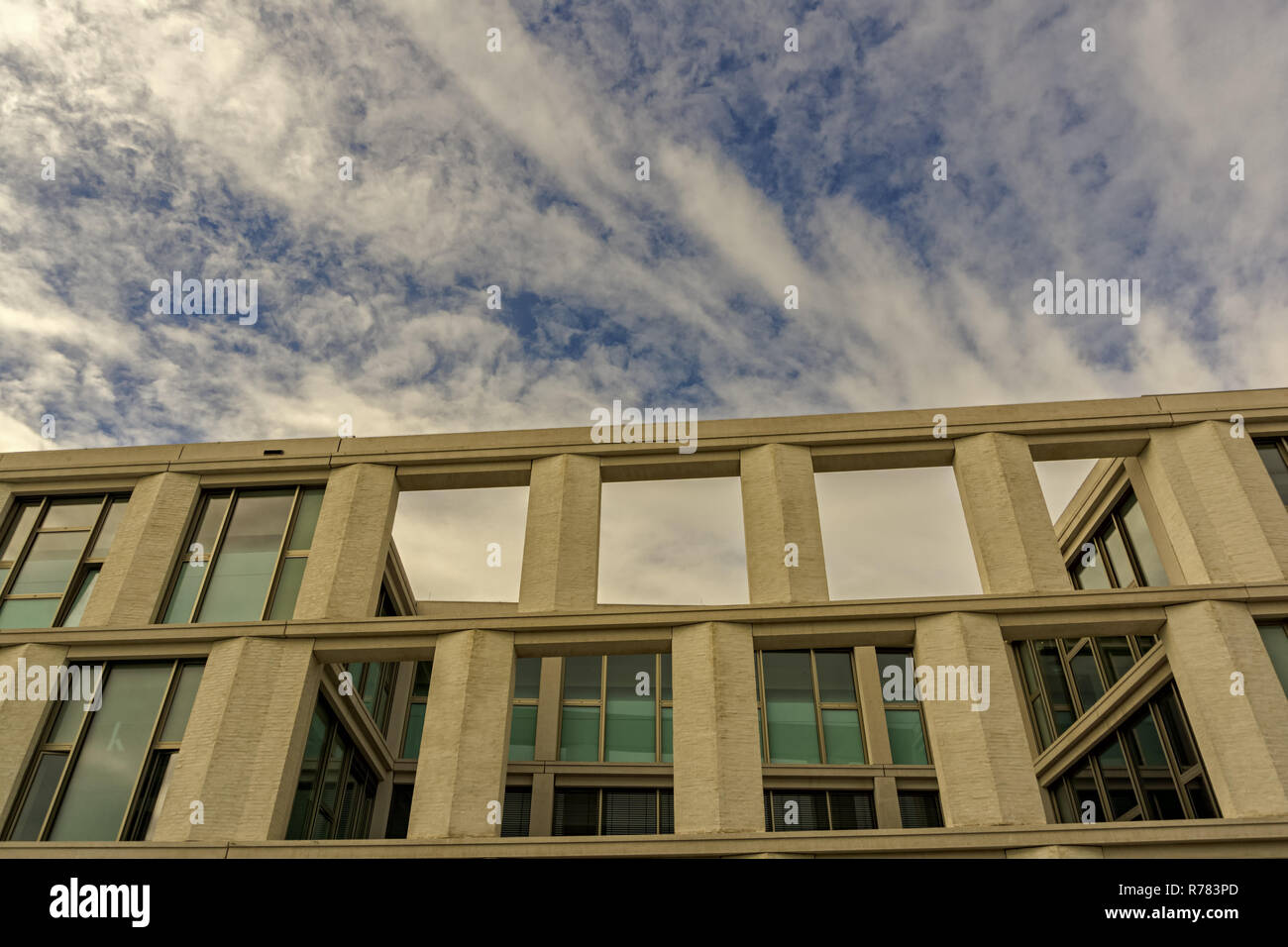 The upper part of a modern building below a cloudy summer sky Stock ...