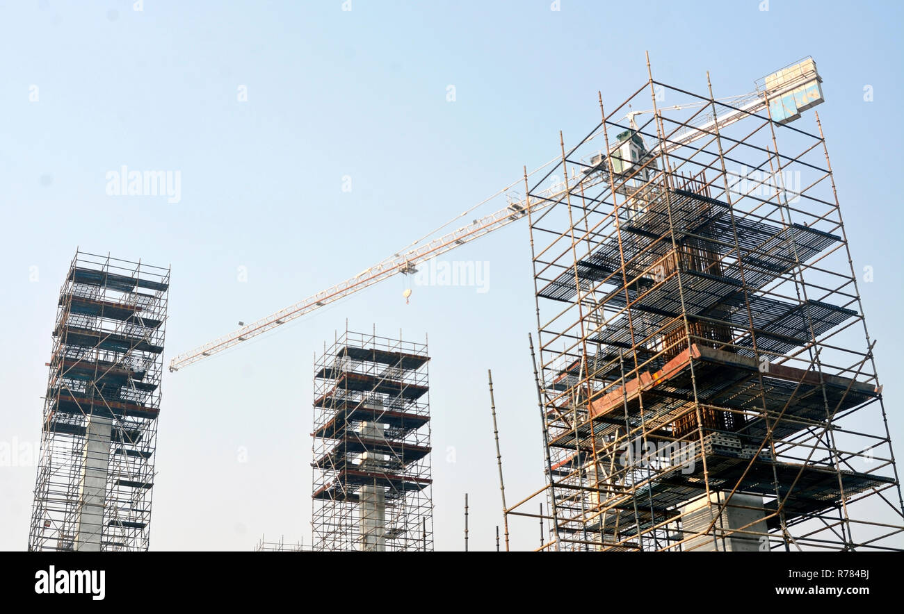 Crane and high-rise construction site Stock Photo - Alamy