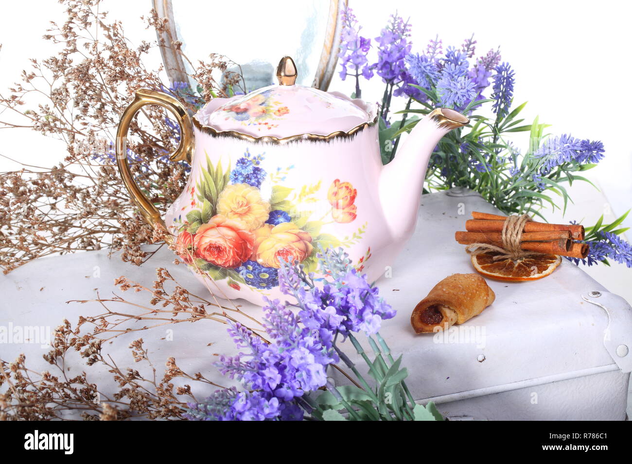 Still life with a teapot and biscuits Stock Photo - Alamy
