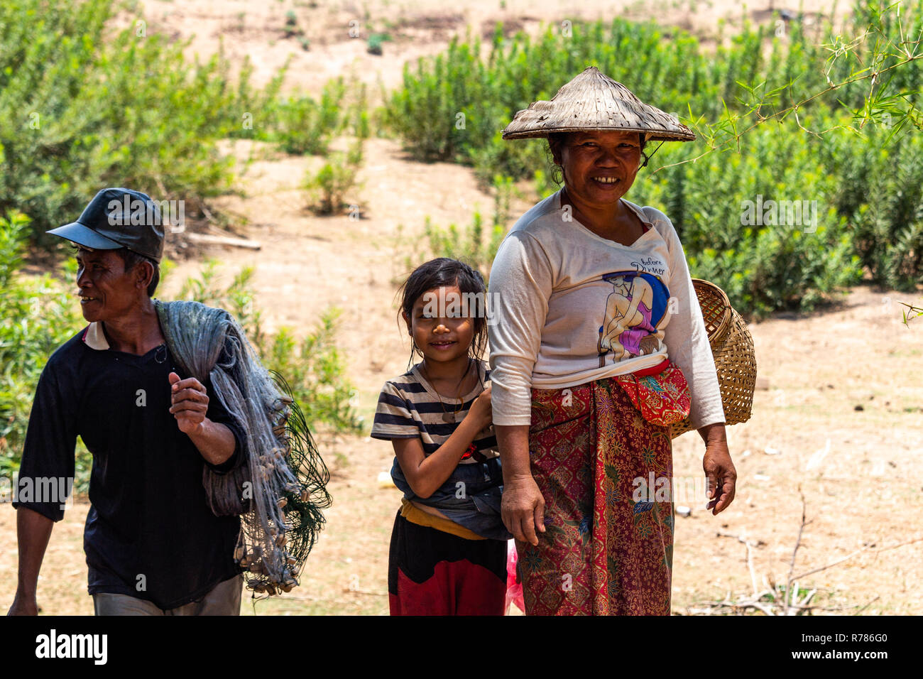 Don Daeng, Laos - April 27, 2018: Local family coming from fishing in ...