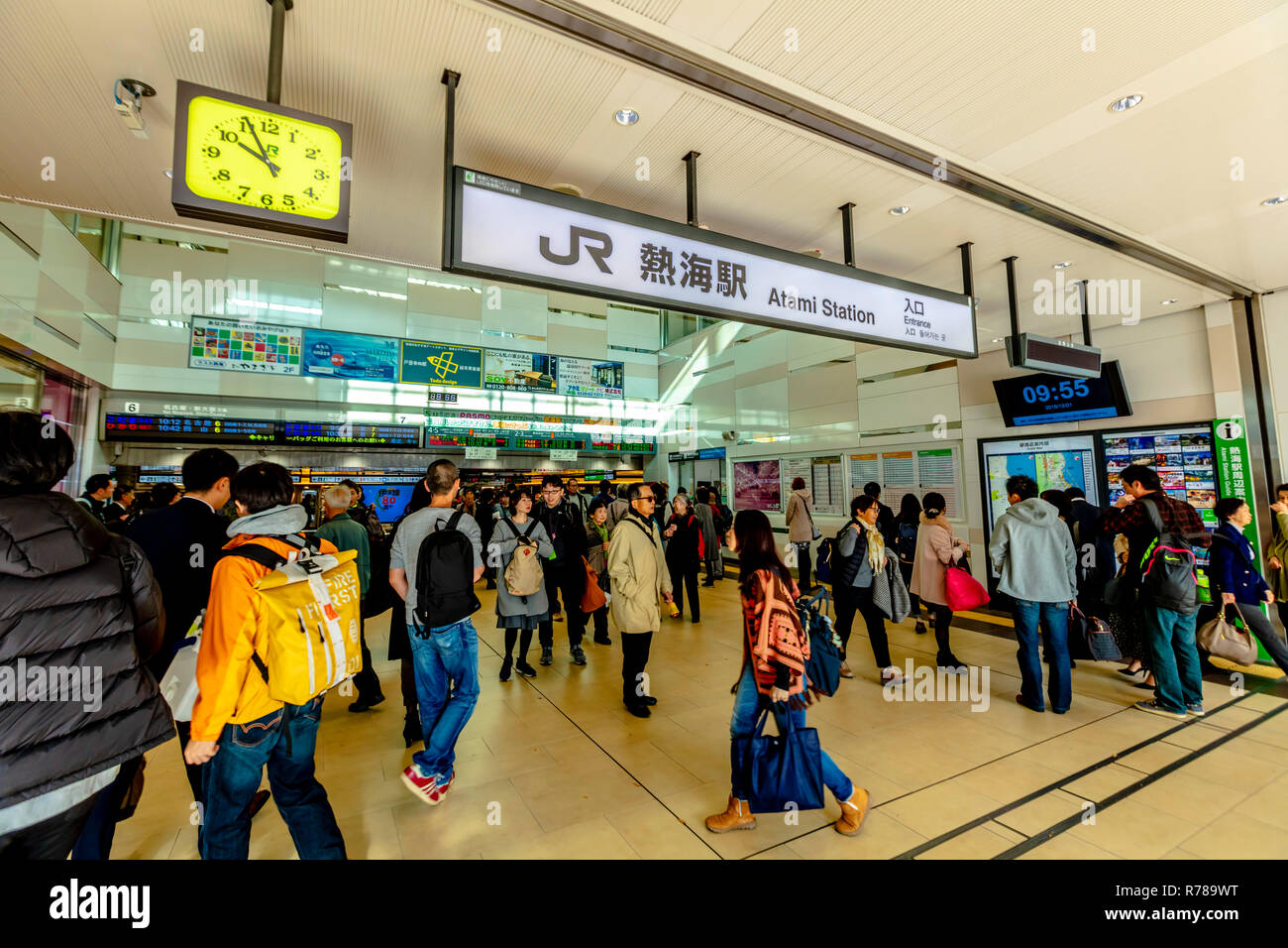 JR Atami station signage with travellers Stock Photo - Alamy