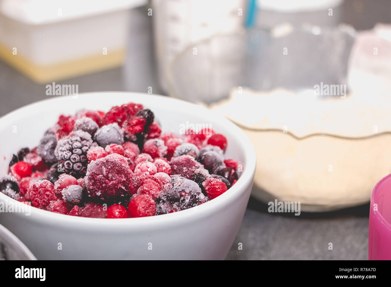 closeup of frozen red berries on a kitchen counter Stock Photo - Alamy