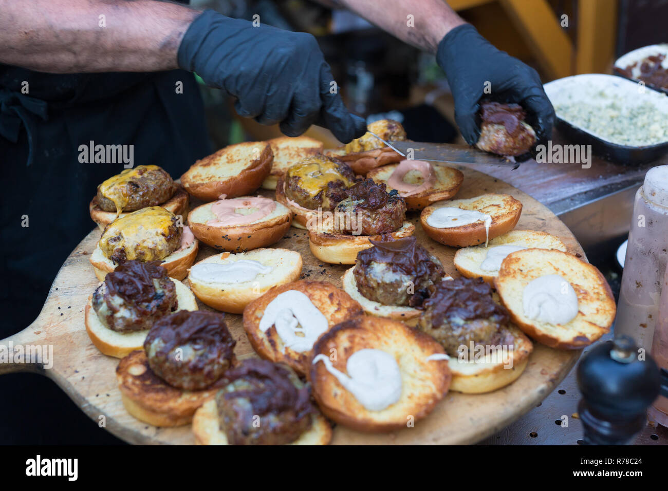 Chef making beef burgers outdoor on open kitchen international food ...