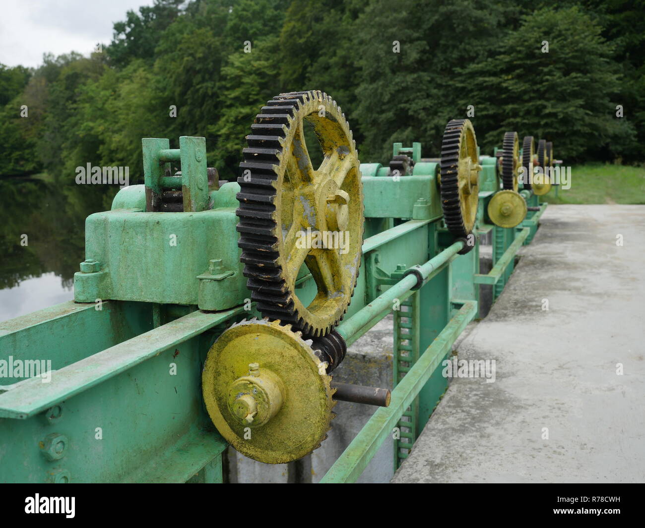 water barrier lifting mechanism with toothed wheels Stock Photo - Alamy