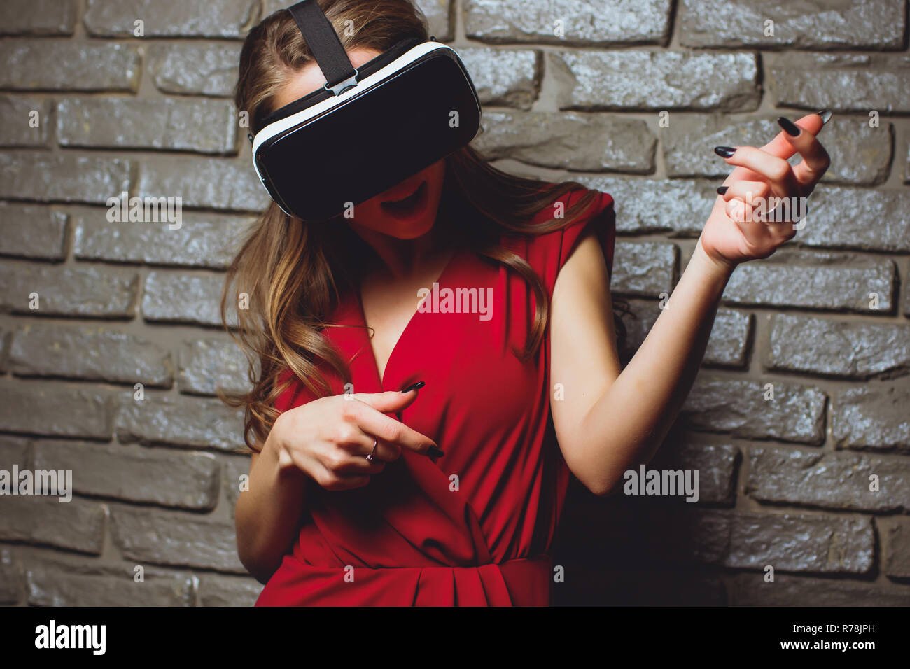 girl in red dress virtual glasses vr Stock Photo - Alamy