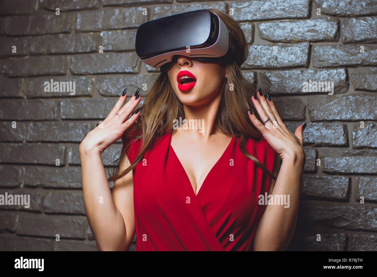 girl in red dress virtual glasses vr Stock Photo - Alamy