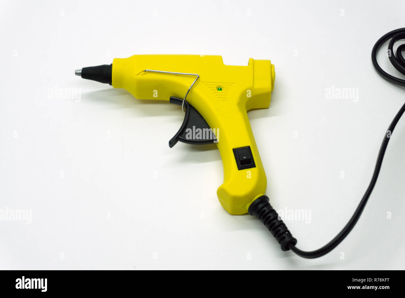 Hot glue gun tool white work appliance Stock Photo - Alamy