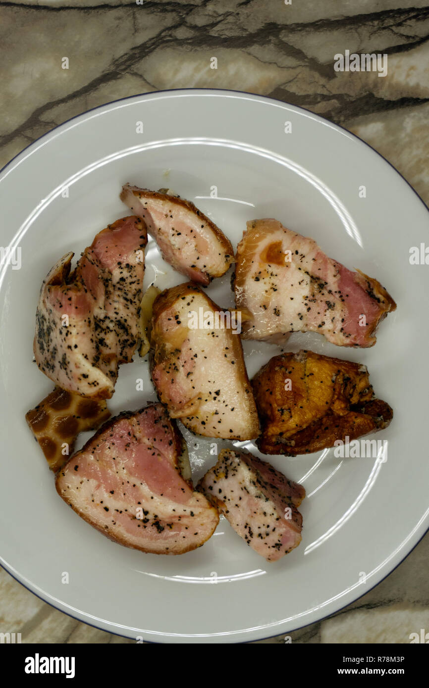 Pieces of fried bacon rashes salt saturated Stock Photo - Alamy