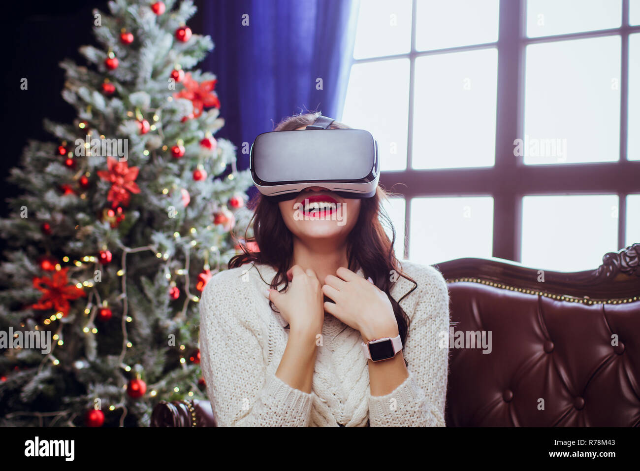 Attractive woman wearing virtual reality goggles. VR headset. Virtual ...
