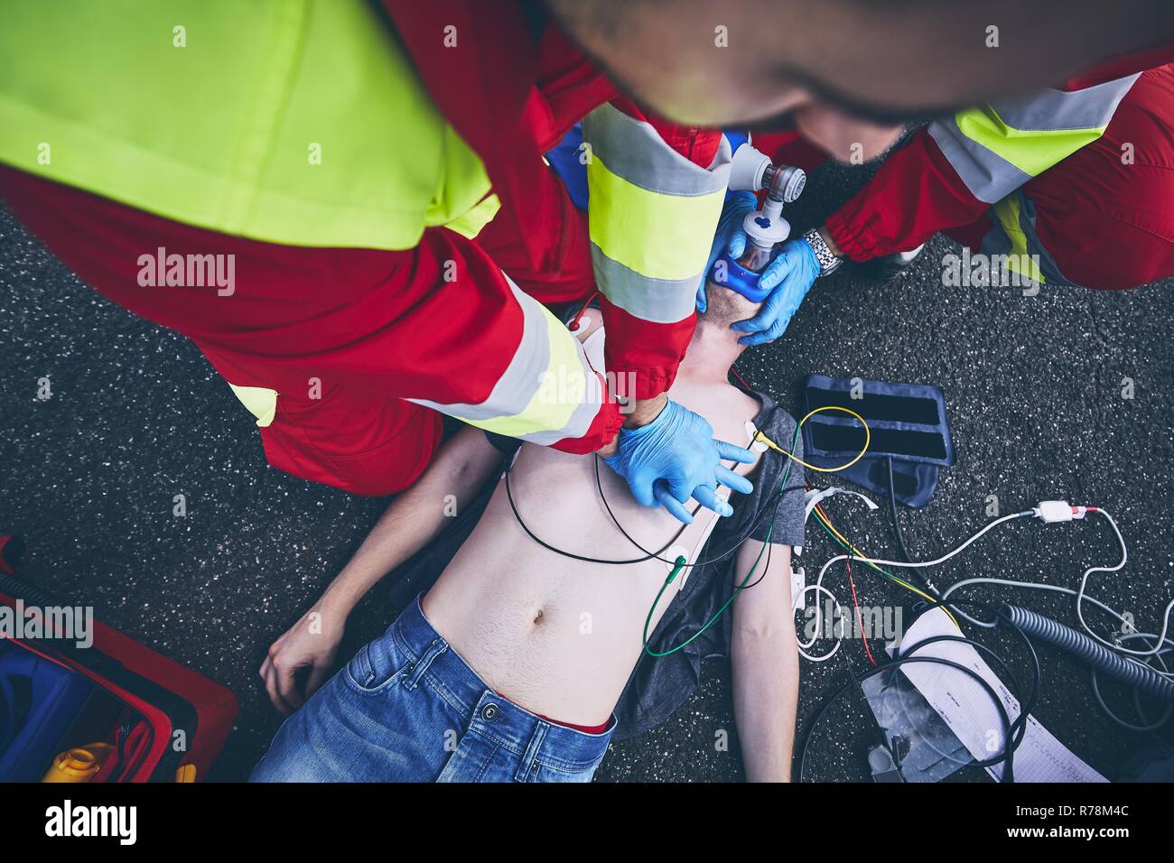 Cardiopulmonary resuscitation. Rescue team (doctor and a paramedic) resuscitating the man on the ...