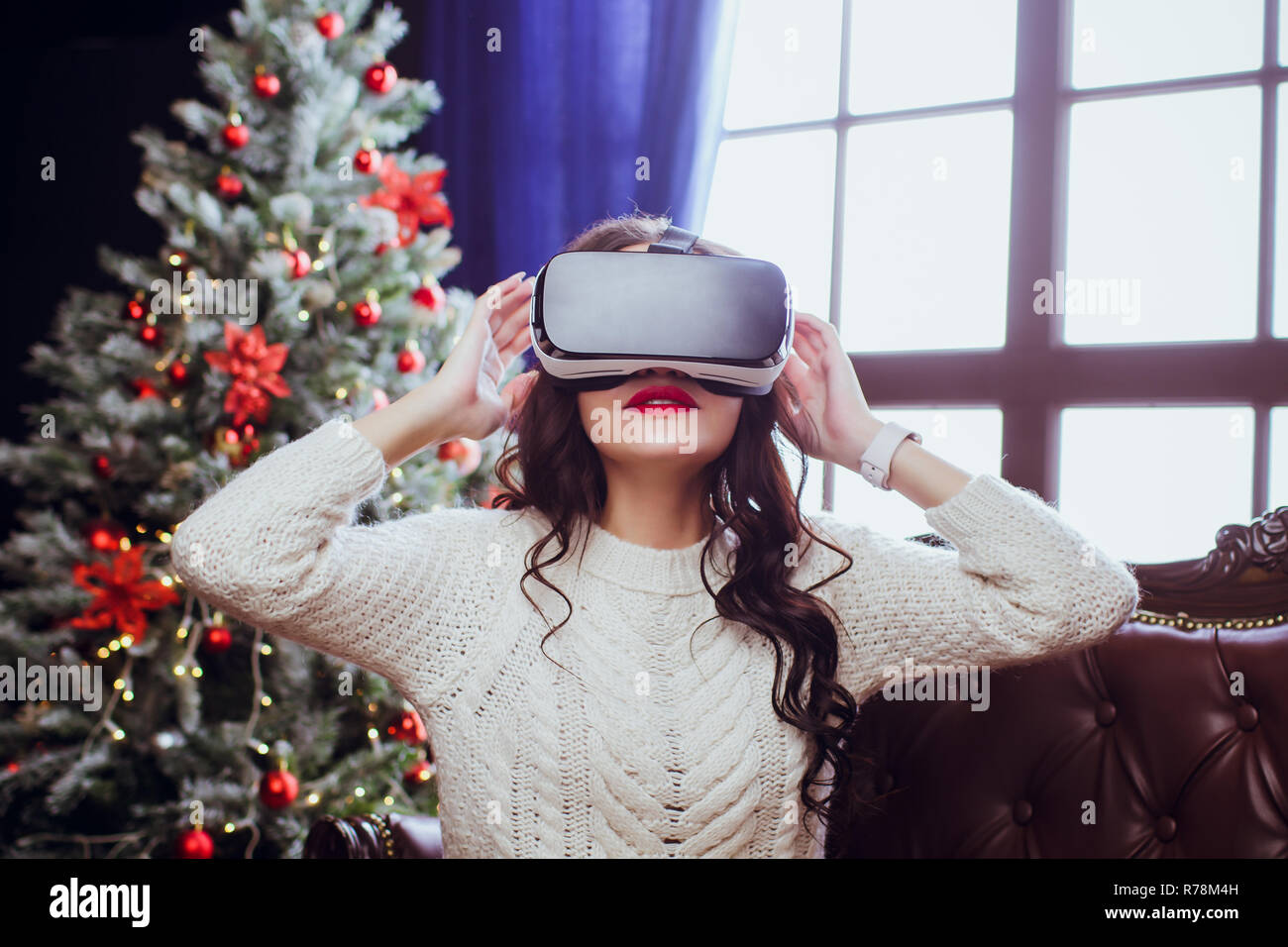 Attractive woman wearing virtual reality goggles. VR headset. Virtual ...