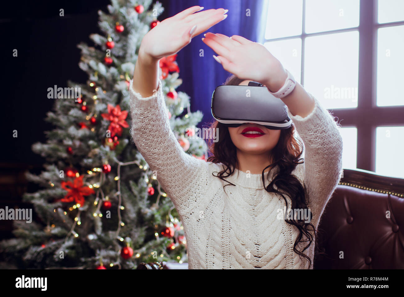 Attractive woman wearing virtual reality goggles. VR headset. Virtual ...