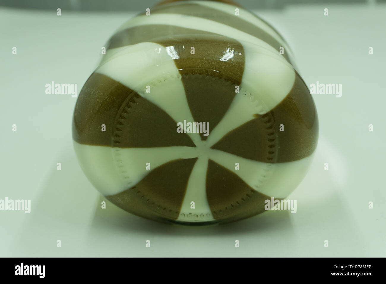 Chocolate paste in a plastic jar. Chocolate - milk paste in a plastic ...