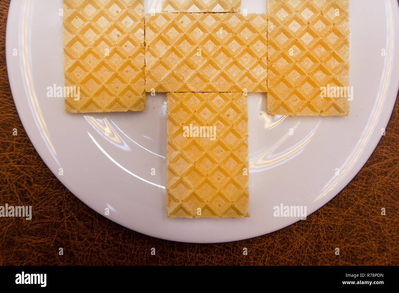 woman hands prepare waffle for serving process.waffle made from dough ...