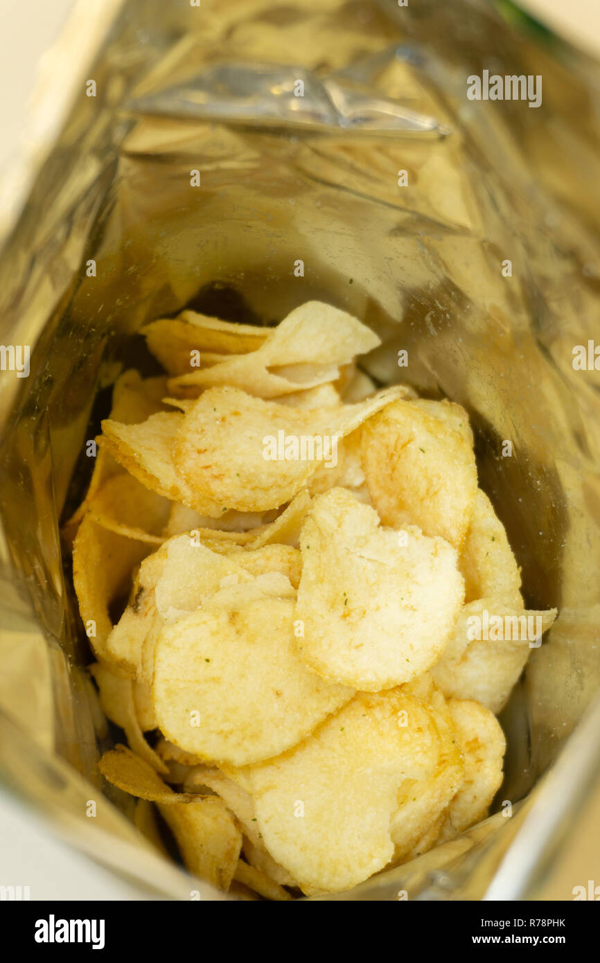 heap of potato crisps on white background Stock Photo - Alamy