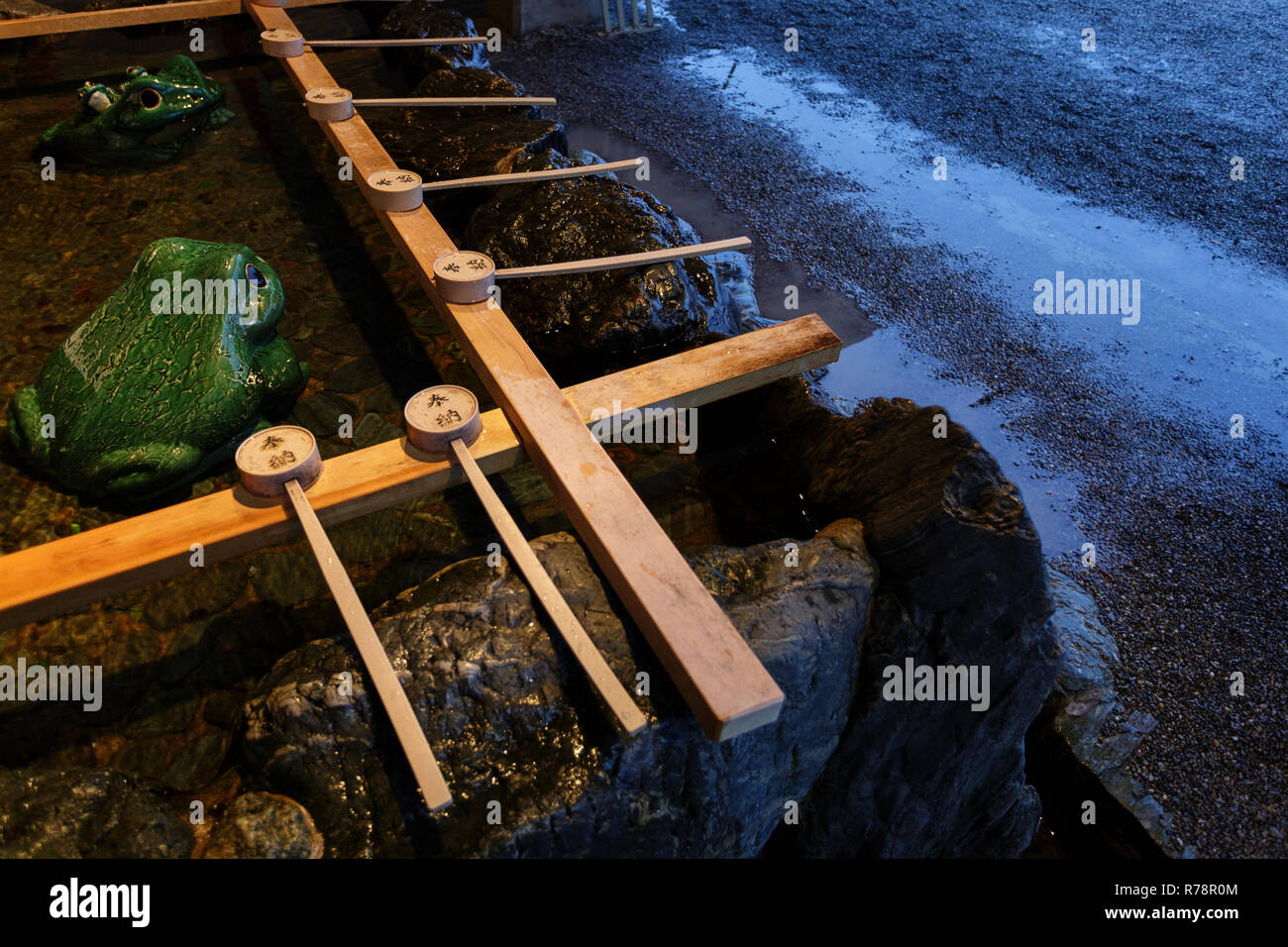 Wooden dipper of holy zen water in Japan Shinto temple, Meoto Iwa; Mie ...