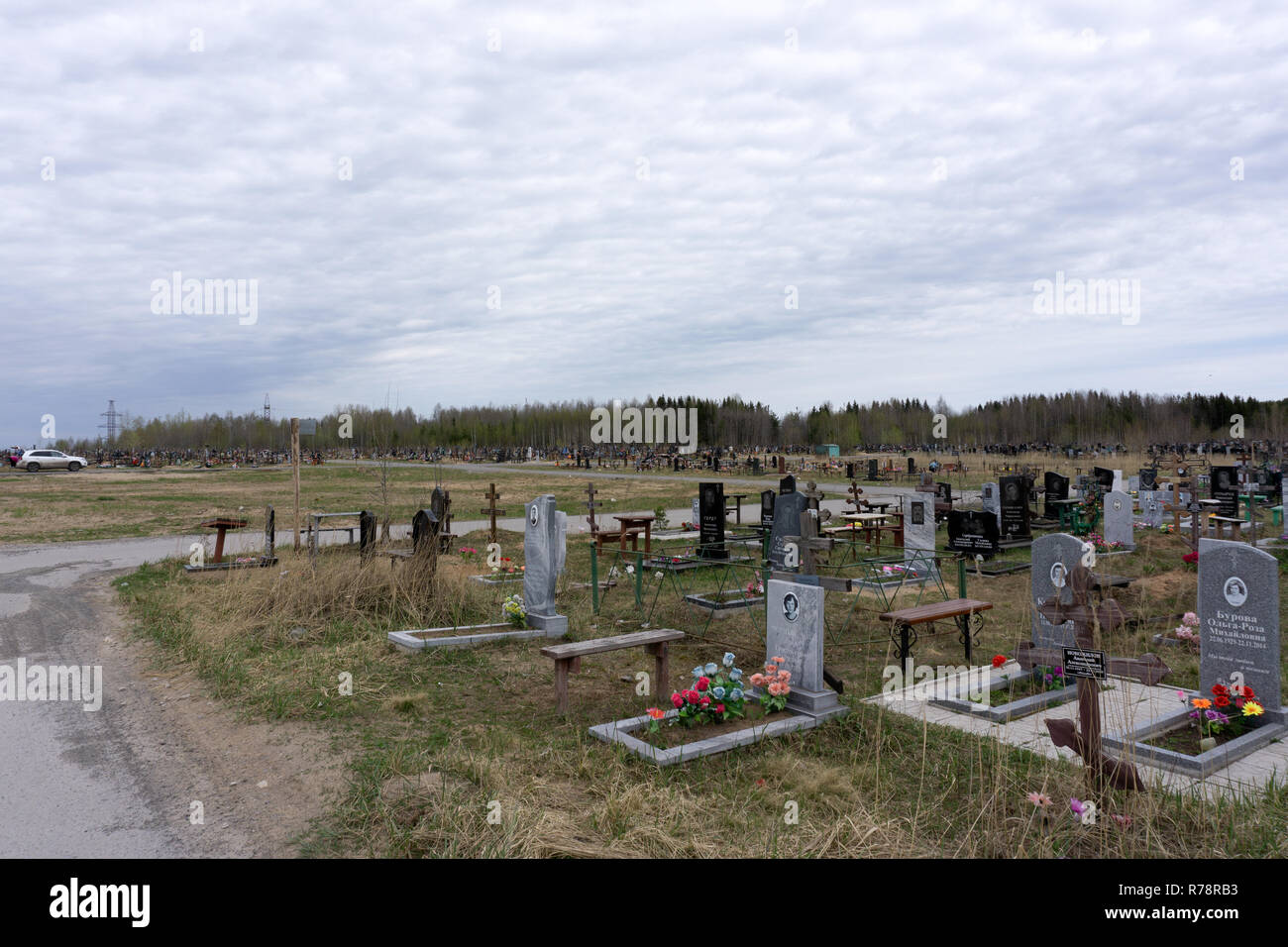 in a graveyard with marble tombstones . Russia Berezniki 23 may 2018 ...