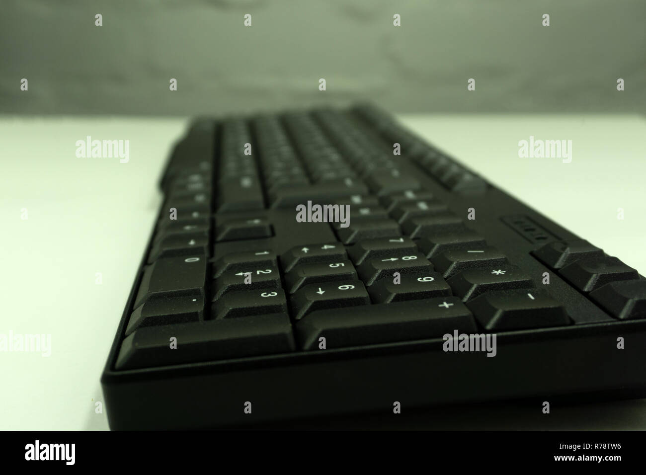 Keyboard from computer side view black on light Stock Photo - Alamy
