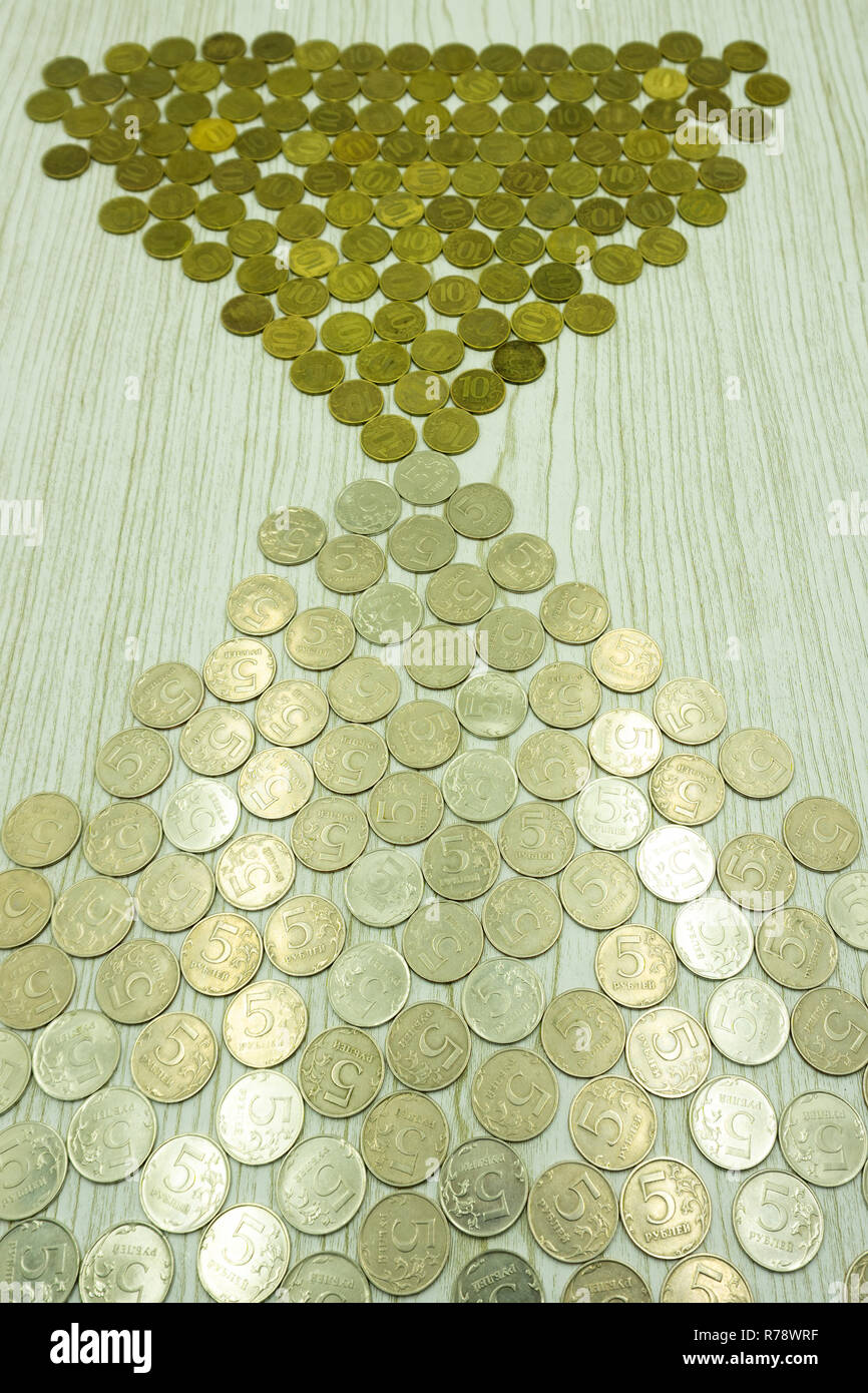 Coins in wood textural abstract background economy Stock Photo - Alamy