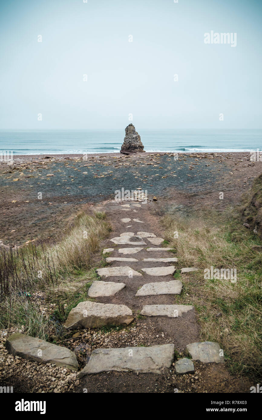 Rocky path leading down to the remains of a rock stack on Blast Beach ...