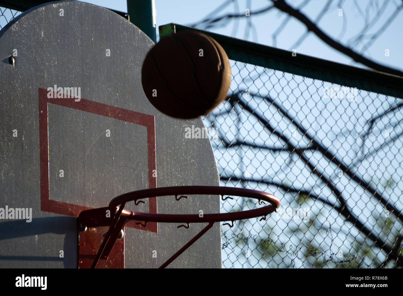 Basketball going through the basket at a sports arena intentional ...