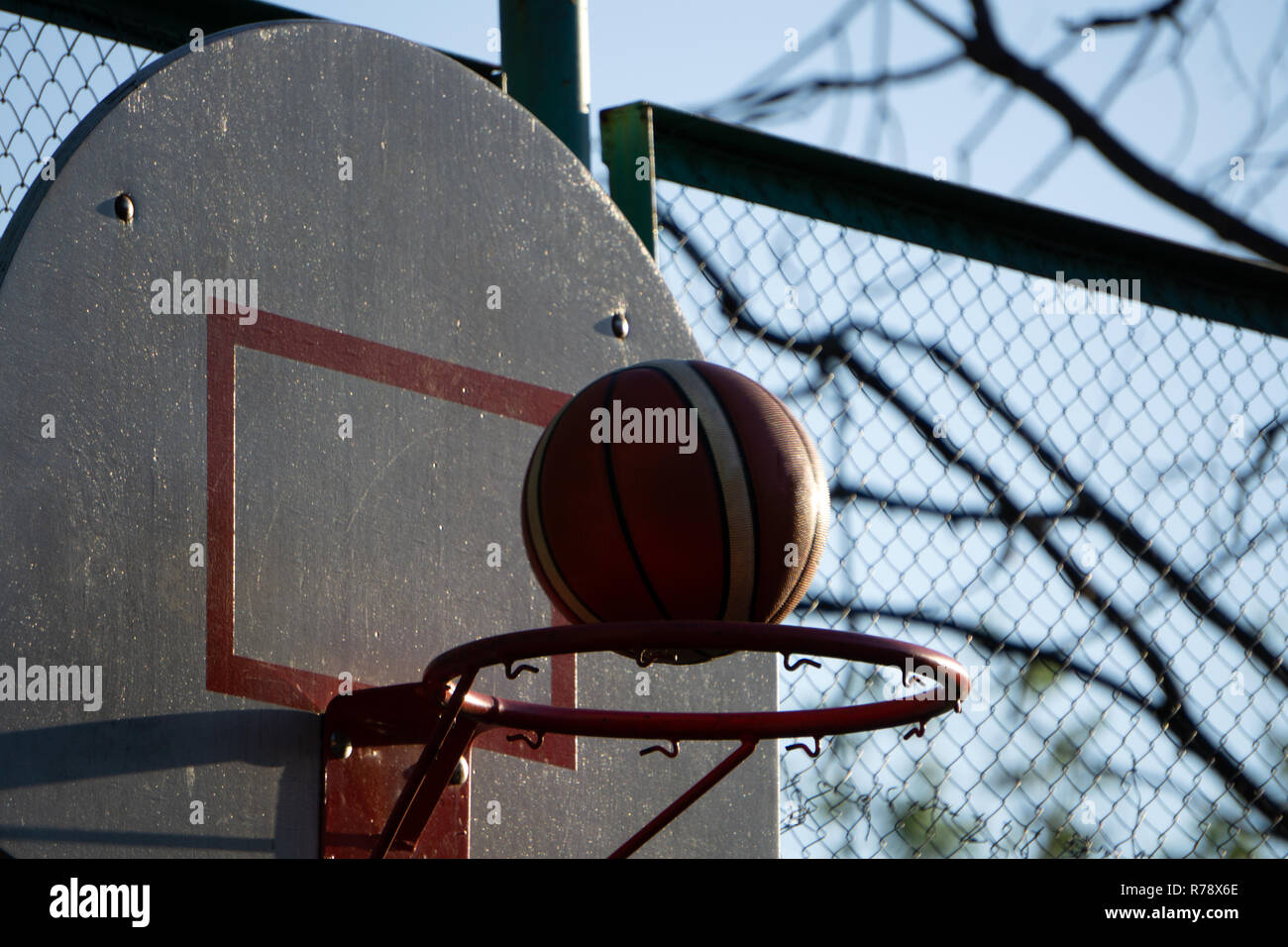 Action shot of basketball going through basketball hoop and net Stock ...