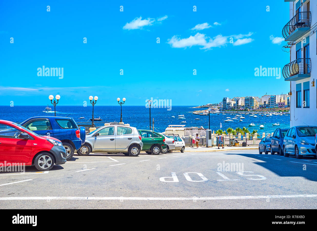 BUGIBBA, MALTA - JUNE 14, 2018: The seaside road winds along the curved ...